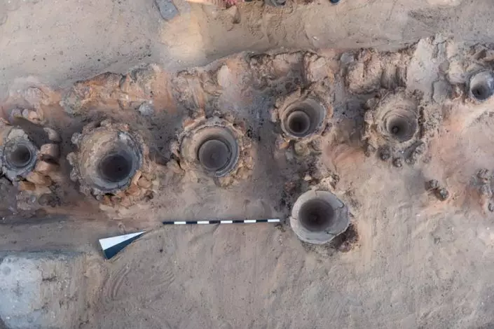 These pottery basins were used to heat up a mixture of grains and water to produce beer in what archaeologists believe to be the oldest known beer brewery. Photo courtesy of the Supreme Council of Antiquities, Egyptian Antiquities Ministry.