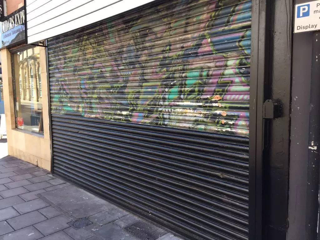 'I Had No Idea': A Bristol Shopkeeper Regrets Accidentally Painting Over One of Banksy's Earliest Murals 10608_2