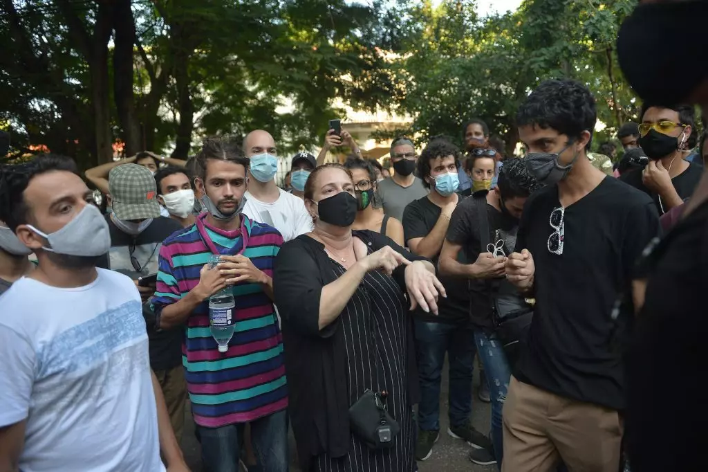 Tania Bruguera speaks with other artists gathered outside the Ministry of Culture in Havana on November 27, 2020. Photo by Yamil Lage/AFP via Getty Images.