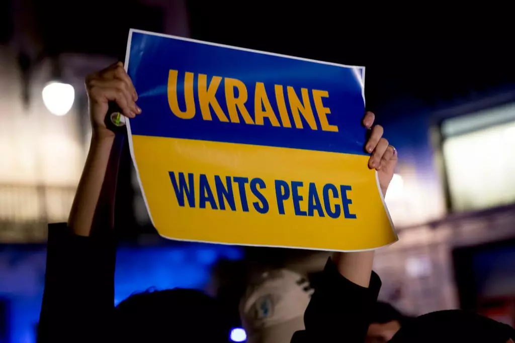 Hundreds of citizens of Ukrainian origin demonstrate in Barcelona against the war between Russia and Ukraine, in Barcelona, Catalonia, Spain, on February 25, 2022. (Photo by Albert Llop/NurPhoto via Getty Images)