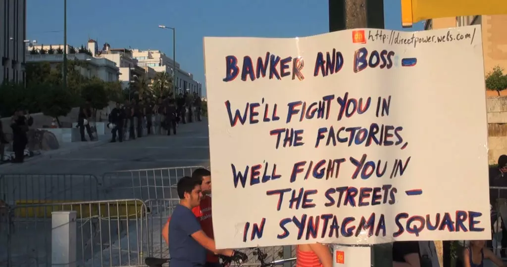 A protest sign in Greece. Image courtesy Zeitgeist Films.