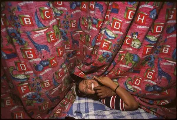 Mary Ellen Mark, Kamla behind Curtains with a Customer, Falkland Road, Bombay, India, 1978