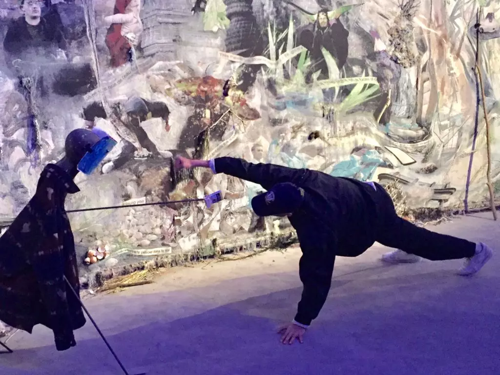 A performer interacts with Laure Prouvost's French pavilion installation. Photo by Naomi Rea.